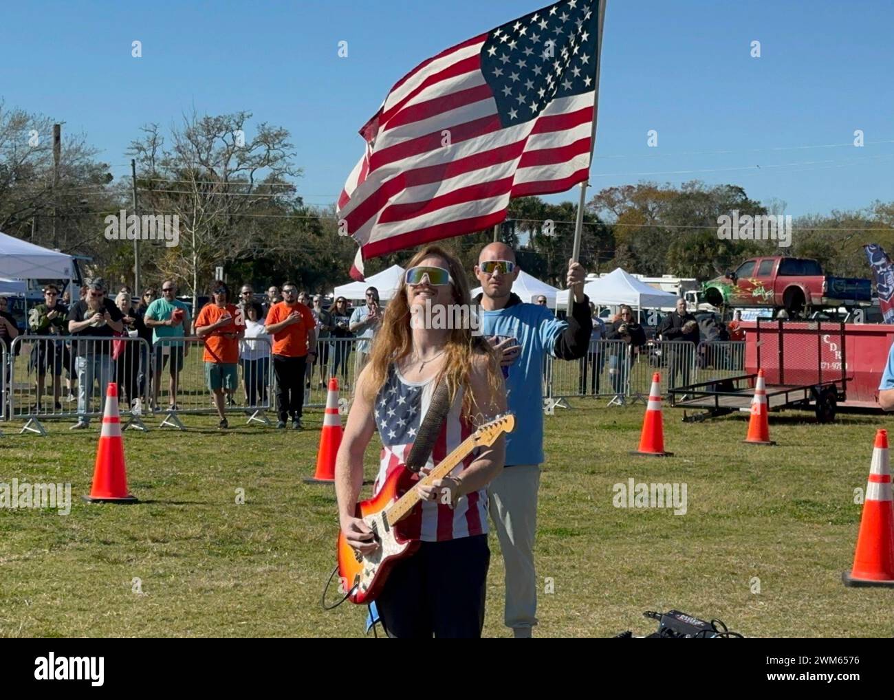Lane Pittman plays the "Star Spangled Banner" on guitar to open the ...
