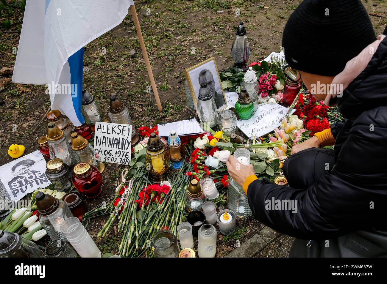 Krakow, Poland, February 24, 2024. A woman light a light as Alexei ...