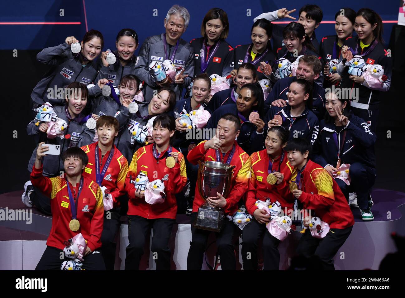Busan, South Korea. 24th Feb, 2024. Gold medalists team China (front), silver medalists team ...