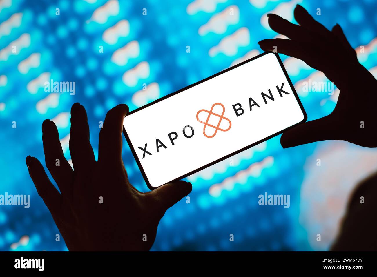 In this photo illustration, the Xapo Bank logo is displayed on a smartphone screen Stock Photo ...