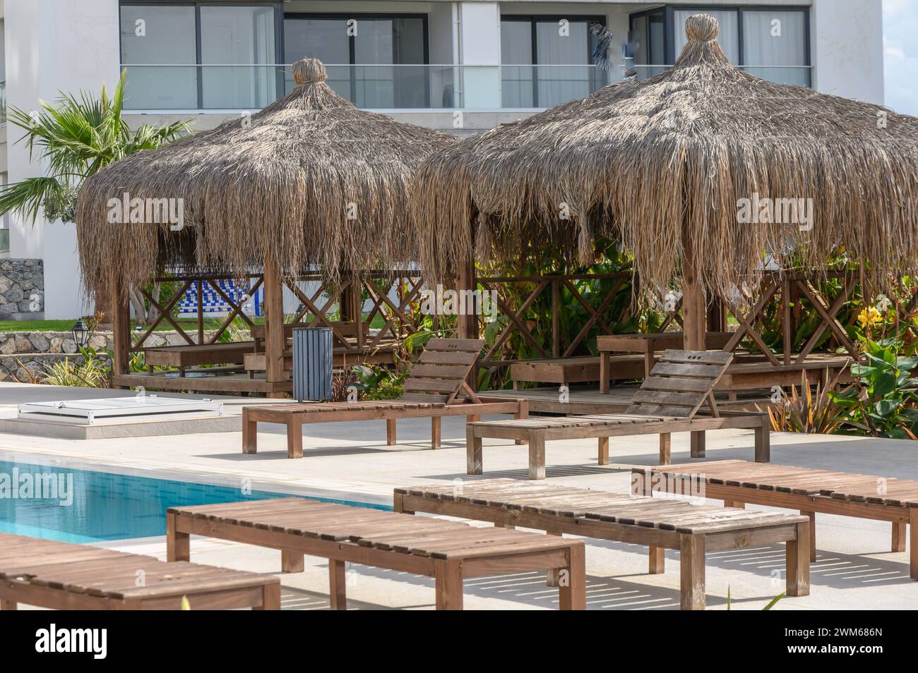 bungalows and beach chairs near the pool and cafe in Cyprus Stock Photo ...