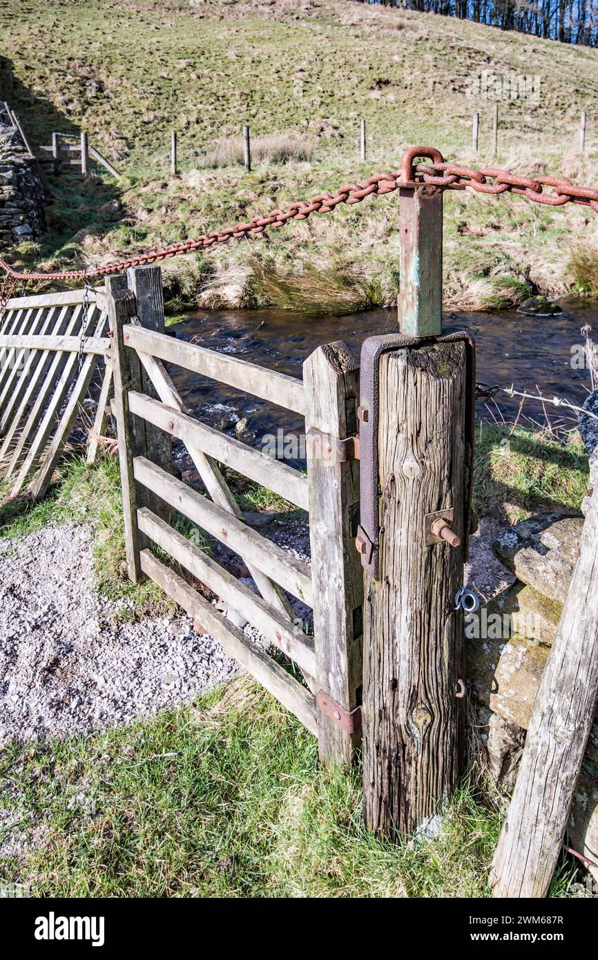 Gate leading to a narrow beck-side walk alongside long Preston beck. A ...