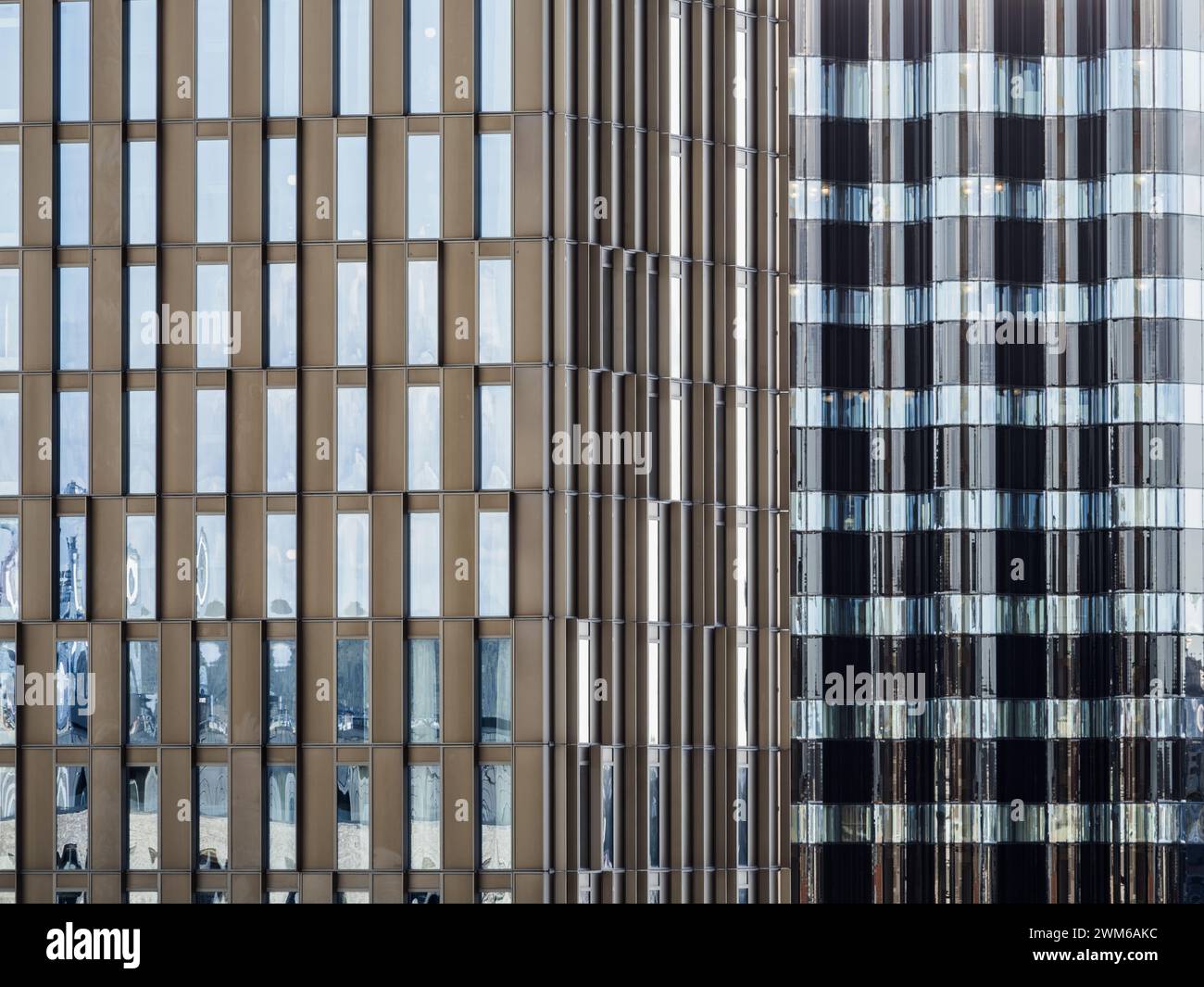 Two tall buildings standing next to each other in the urban landscape ...