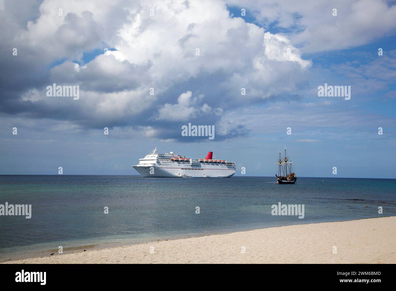The scenic view of a cruise liner and the replica of a pirate ship ...