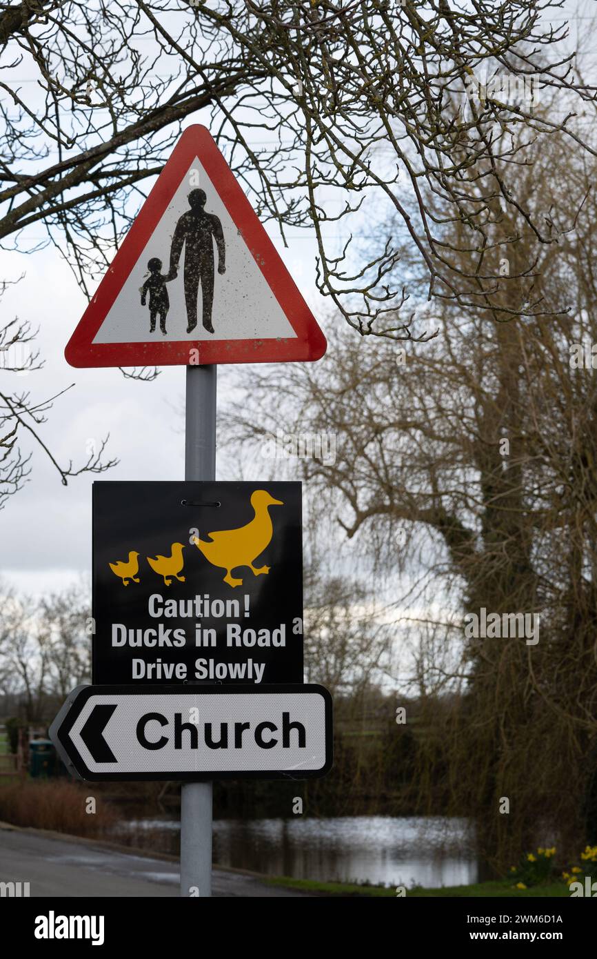 Signs by the duck pond, Willoughby village, Warwickshire, England, UK ...