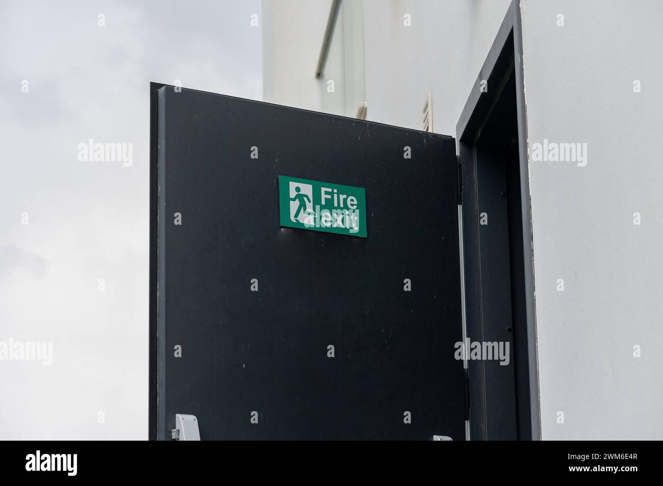 Old green fire exit sign hi-res stock photography and images - Alamy