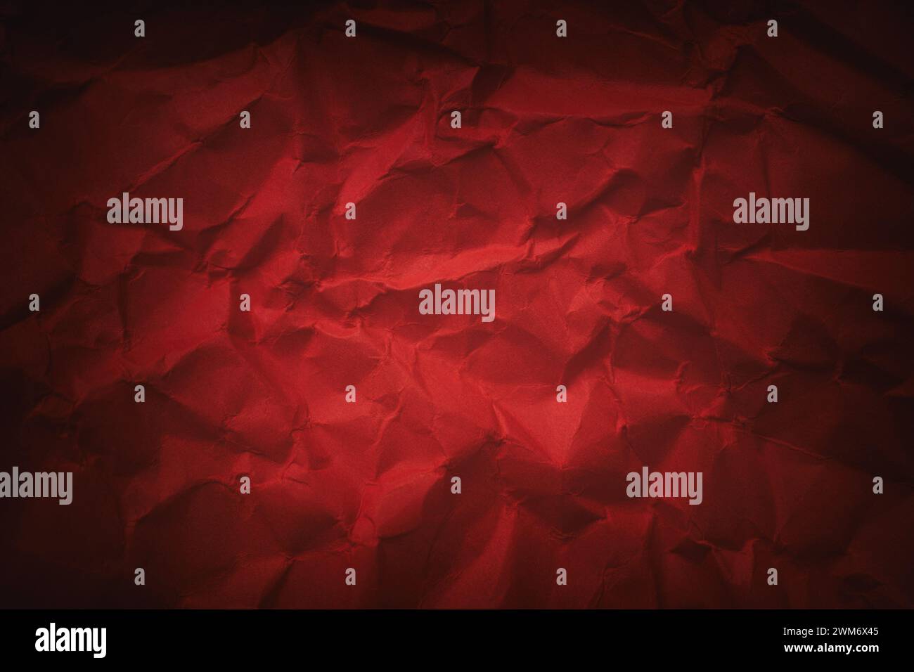 A crumpled crimson paper background. Close up Stock Photo - Alamy