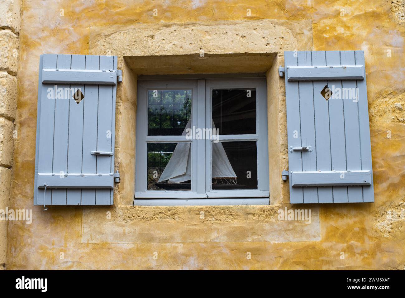 Two open blue shuttered windows with sailing boat silhouette Stock ...