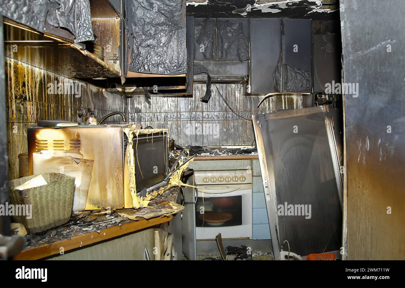Old oven inside the kitchen consumed by flames in a house Stock Photo ...