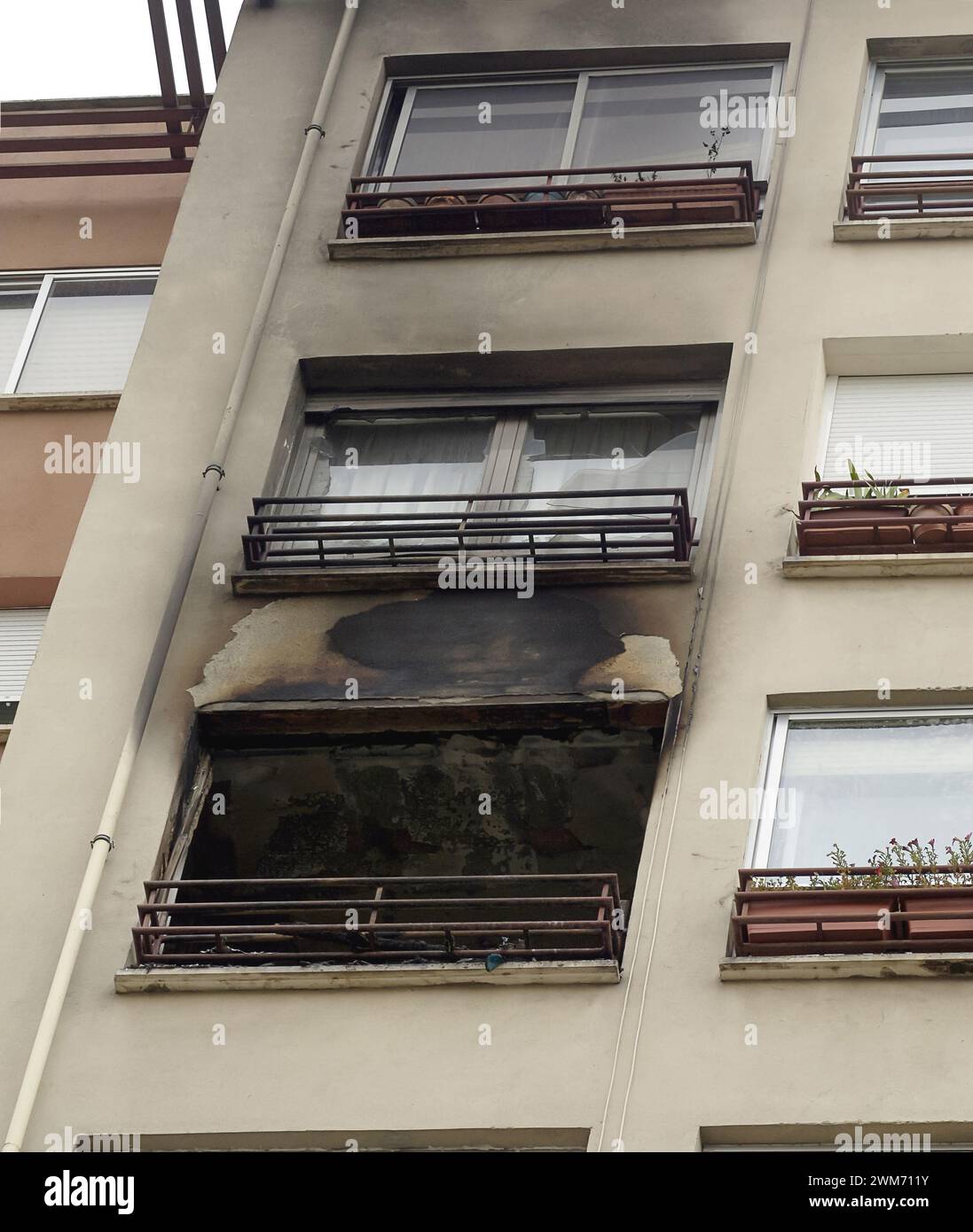 House burned by fire seen from the outside window of a residential ...