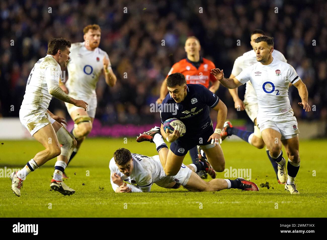 Scotland's Cameron Redpath (centre) is tackled by England's Tommy ...
