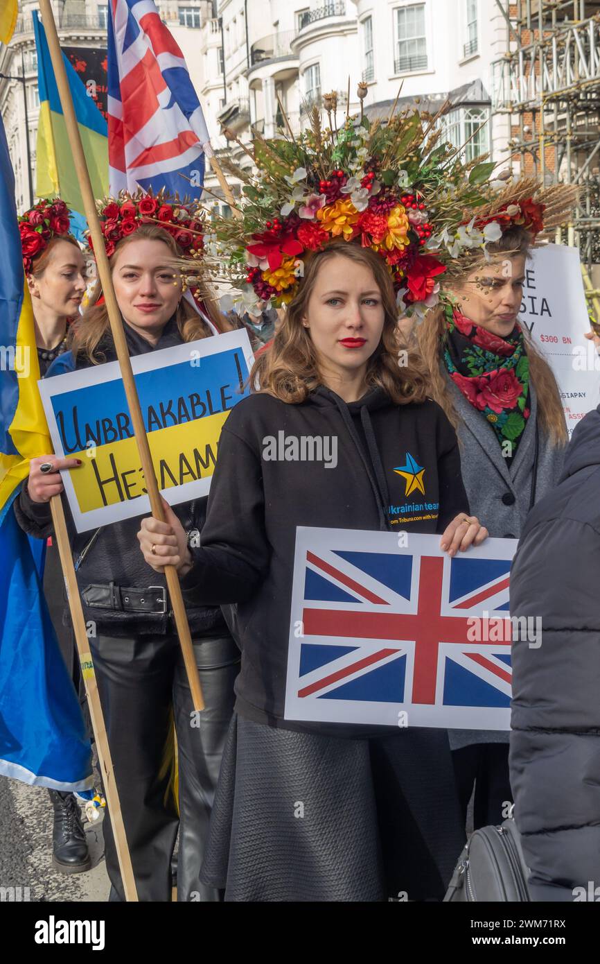 London, UK. 24 Feb 2024. Women with flower head dresses leading the ...