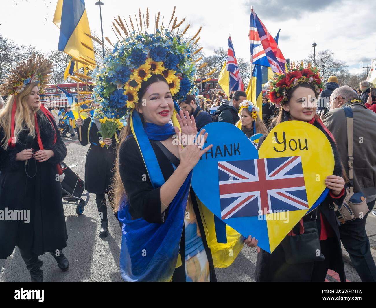 London, UK. 24 Feb 2024. Women with flower head dresses leading the ...