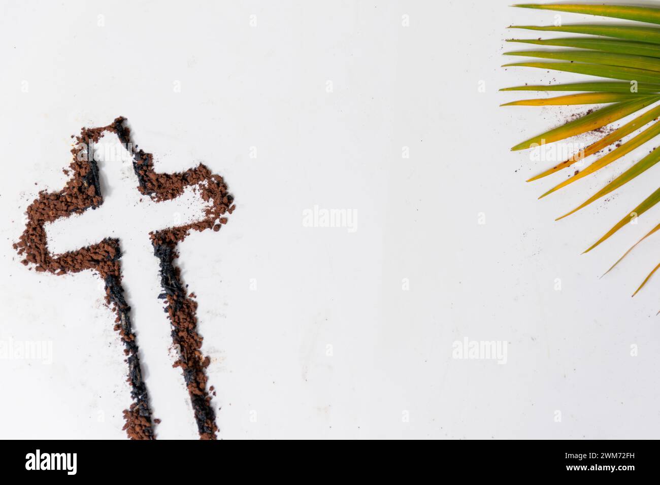 above view of a cross made with earth on a white background Stock Photo ...
