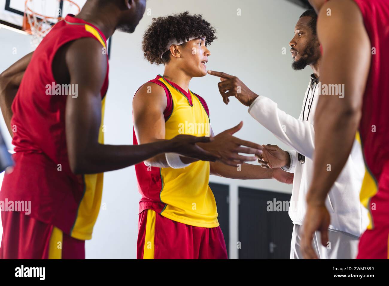 African American men and a young biracial man are in a heated ...