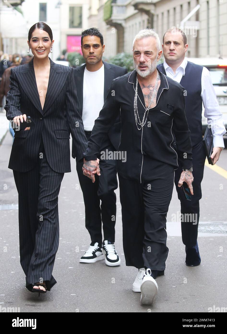 Milan, It. 24th Feb, 2024. Gianluca Vacchi accompanies his wife Sharon ...