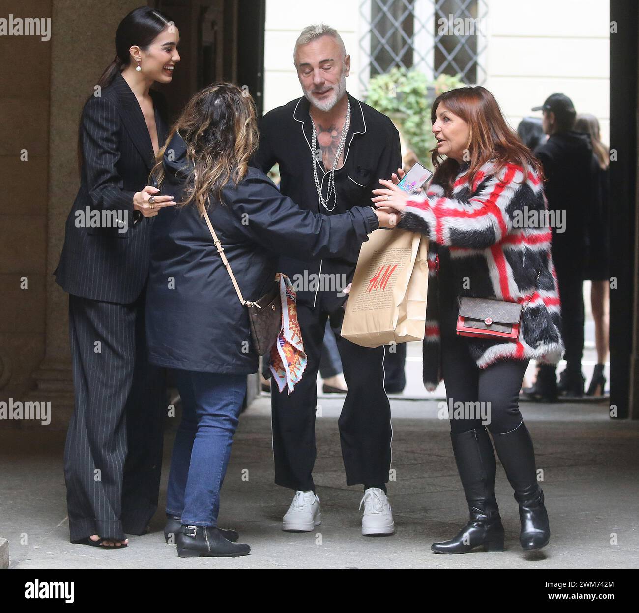 Milan, It. 24th Feb, 2024. Gianluca Vacchi accompanies his wife Sharon ...