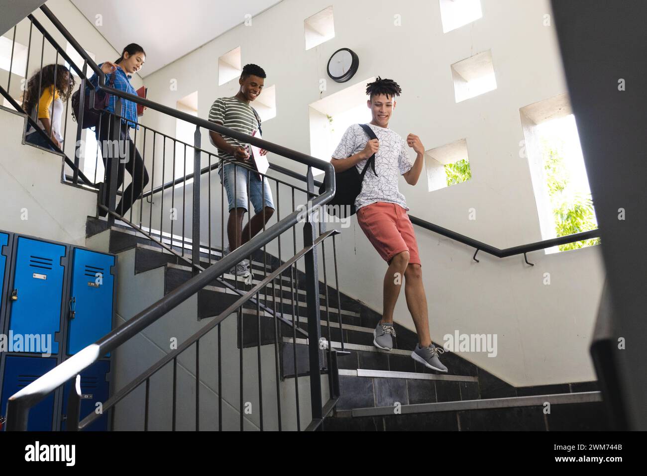 Teenage biracial boys and teenage girls in a high school stairwell Stock Photo - Alamy