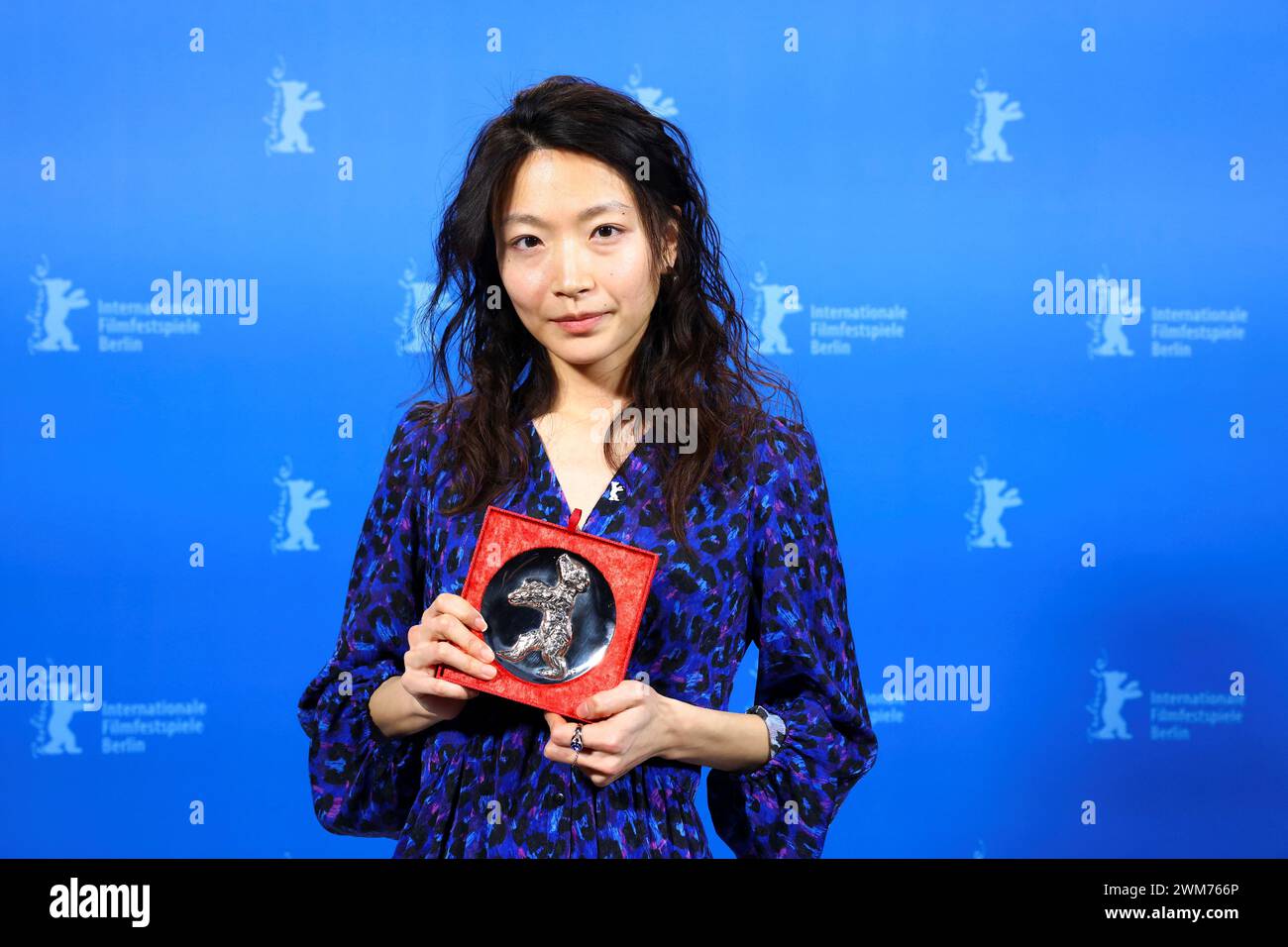 Berlin, Germany. 24th Feb, 2024. Wenqian Zhang poses with the Silver Bear, the jury prize, for ...