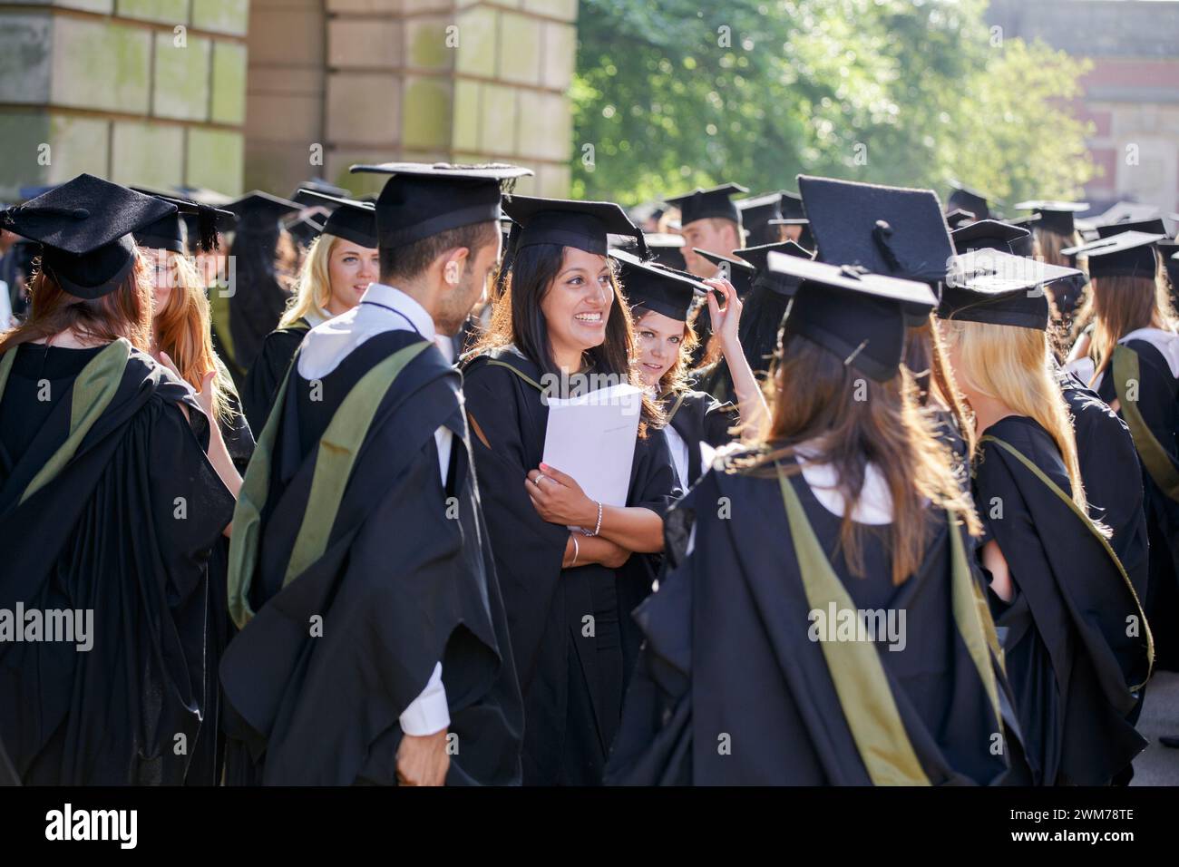 Graduates outside at Birmingham University, UK, after the graduation ...