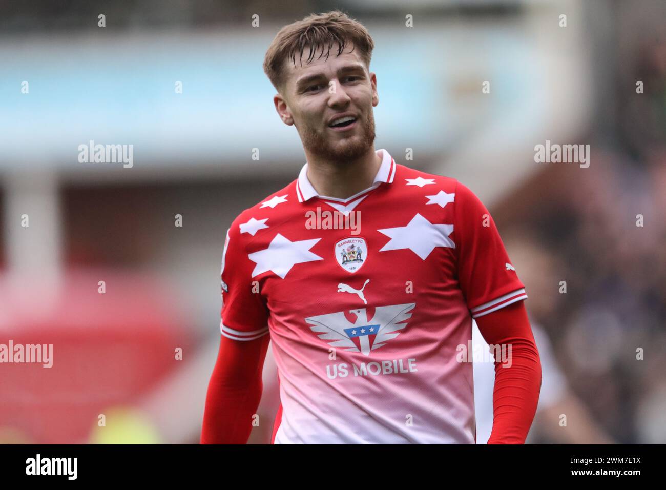 John Mcatee of Barnsley reacts after dribbling the ball out of play ...