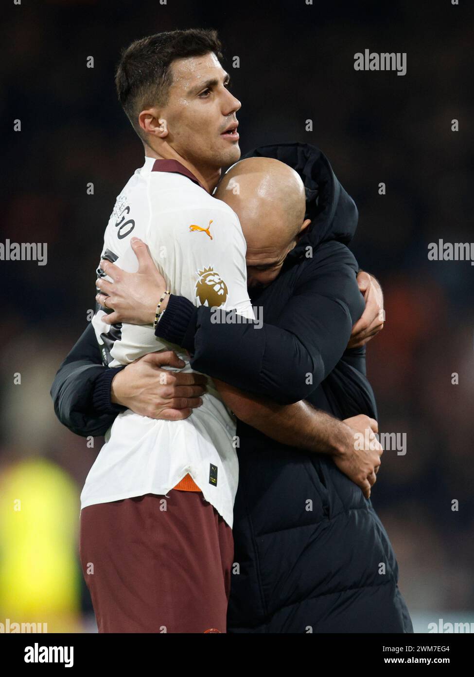 Manchester City's head coach Pep Guardiola embraces Rodrigo after the ...