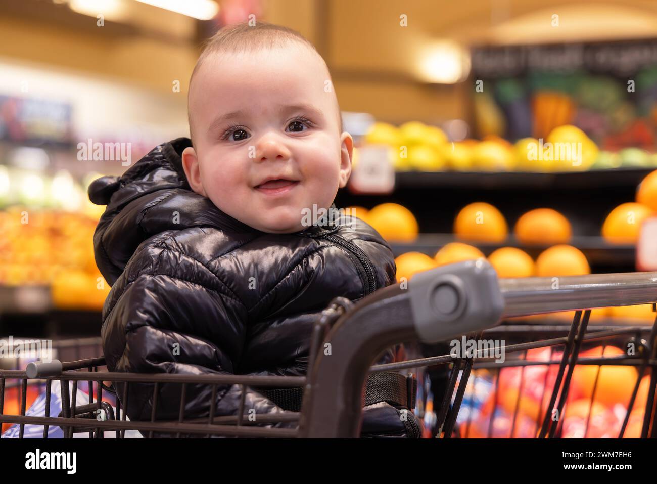 Adorable baby boy in a shopping cart at a grocery store Stock Photo - Alamy