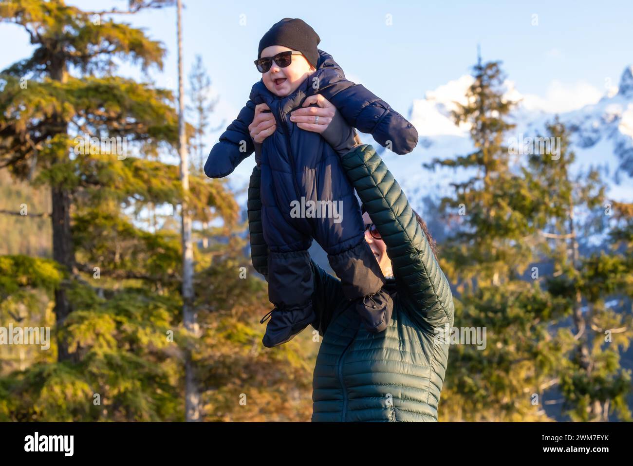 Baby boy and mother happy outside in nature. Squamish, BC, Canada Stock ...