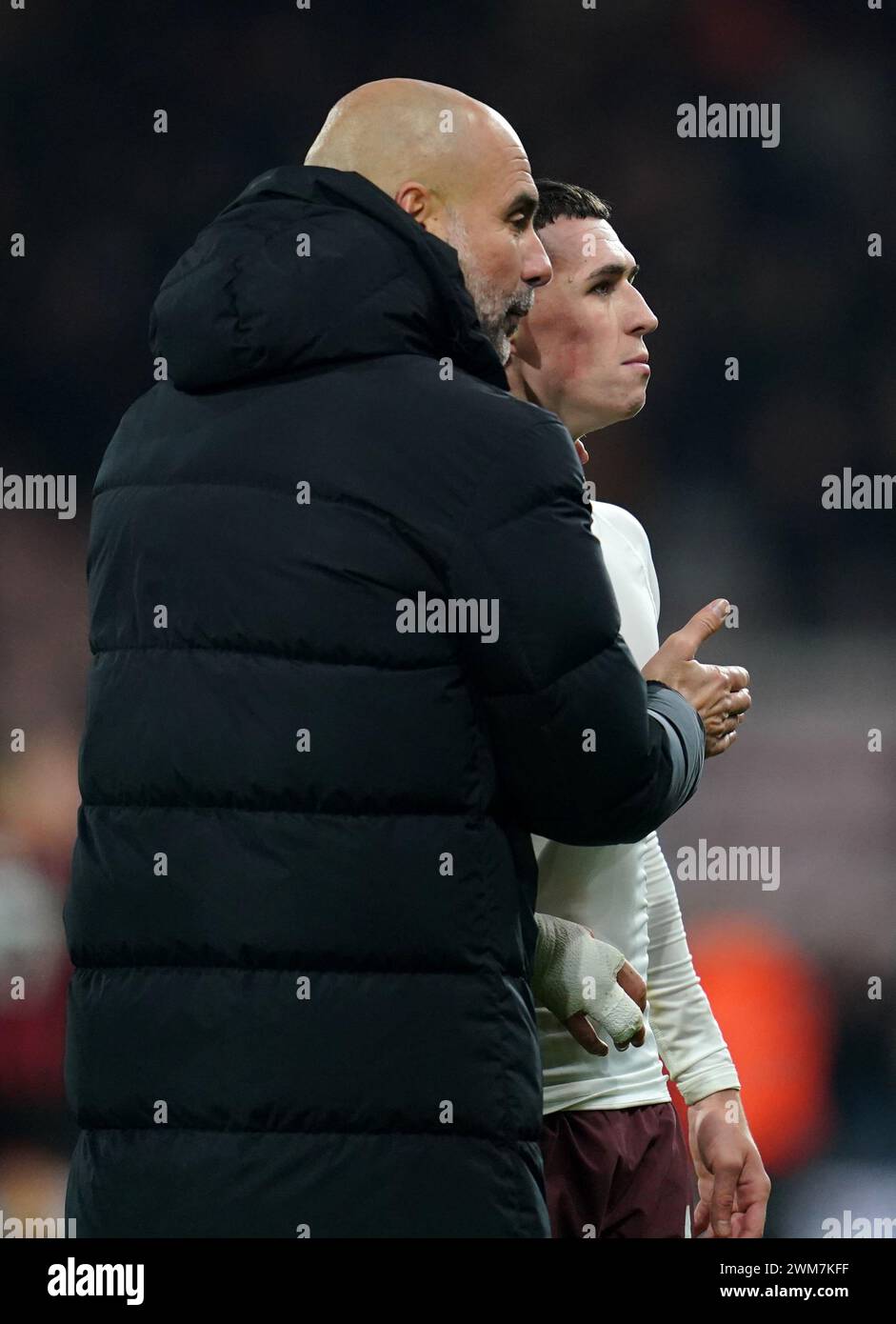 Manchester City manager Pep Guardiola with Phil Foden after the Premier ...