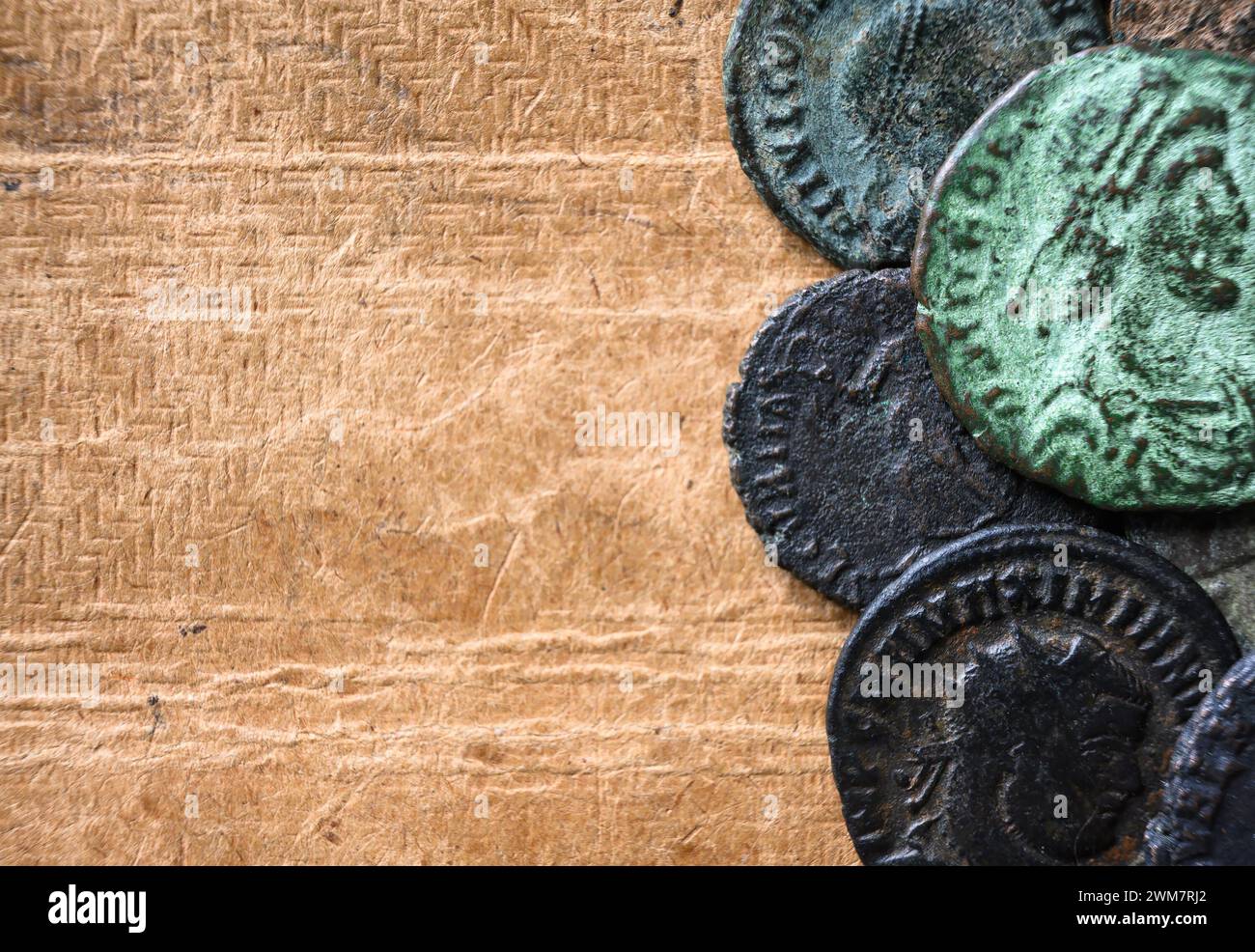Ancient Roman coins on vintage background, top view, old worn bronze ...