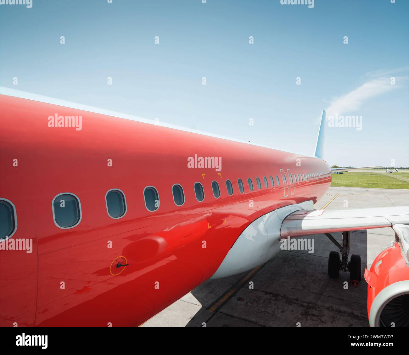 Boarding a red airplane. Perspective view of red passenger plane ...