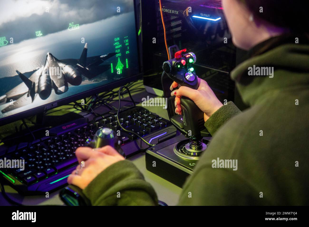 Moscow, Russia. 23rd of February, 2024. A girl plays a military flight ...