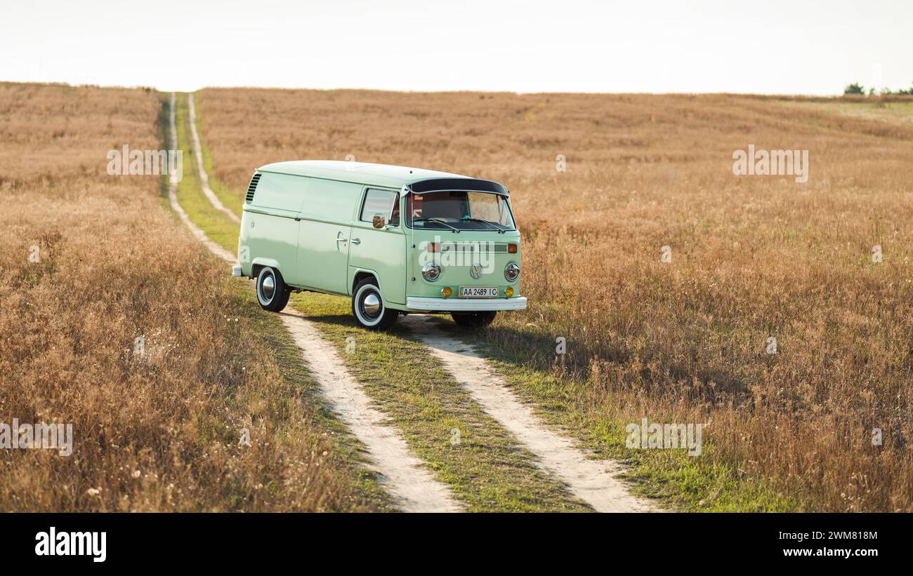 Green classic Volkswagen Transporter van on countryside unpaved ...