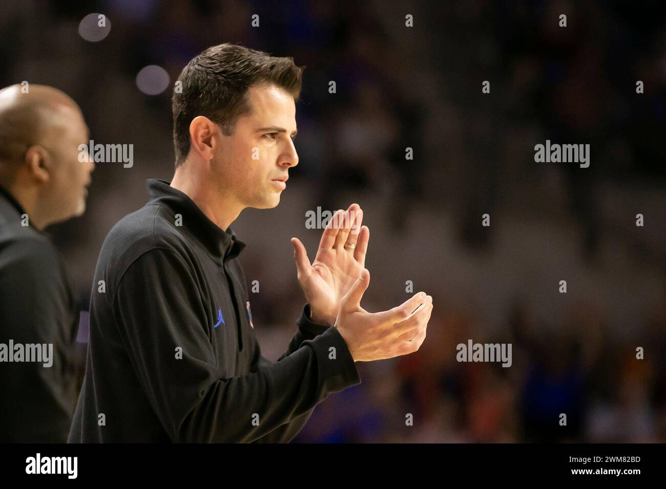 Florida head coach Todd Golden claps during the second half of an NCAA ...