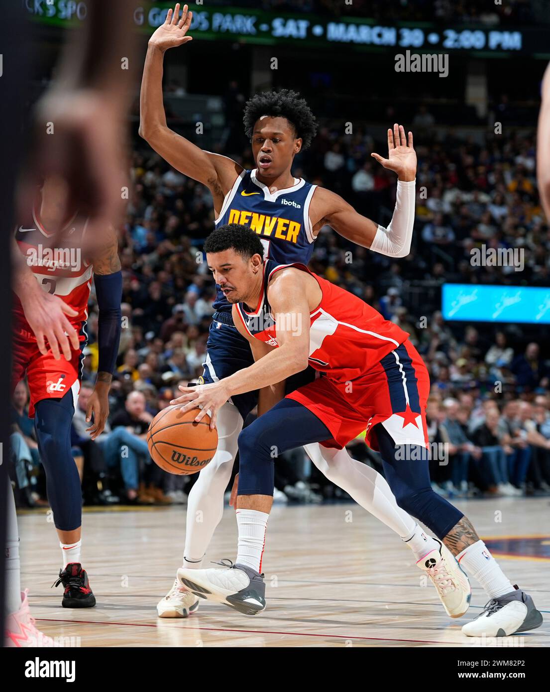 Washington Wizards guard Johnny Davis (1) and Denver Nuggets forward ...