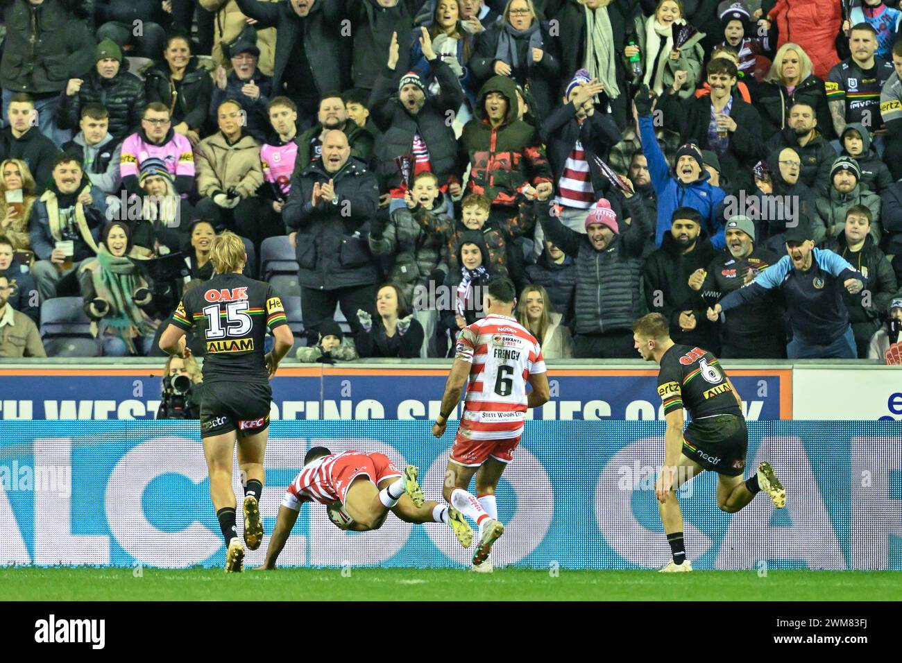 Wigan, UK. 24th Feb, 2024. Kruise Leeming of Wigan Warriors goes over ...