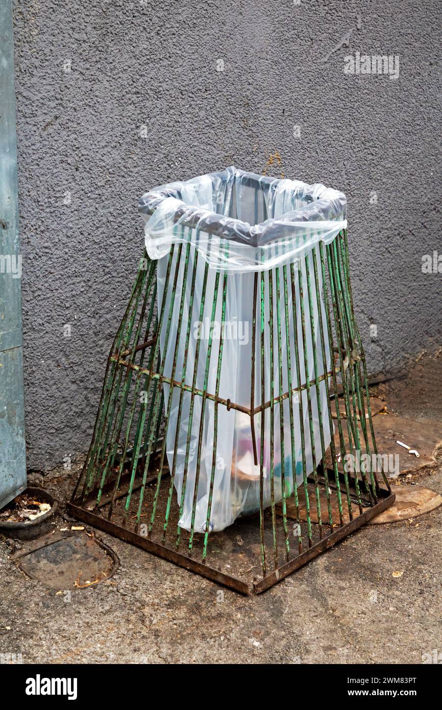 Empty transparent plastic trash bag outside on a street Stock Photo - Alamy
