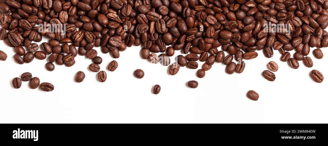 A close-up view of rich, aromatic coffee beans isolated against a clean ...