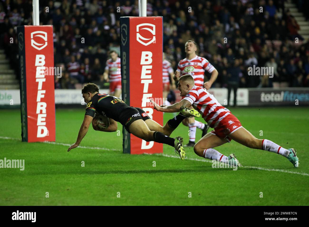 Penrith Panthers' Nathan Cleary (left) scores his sides first try ...