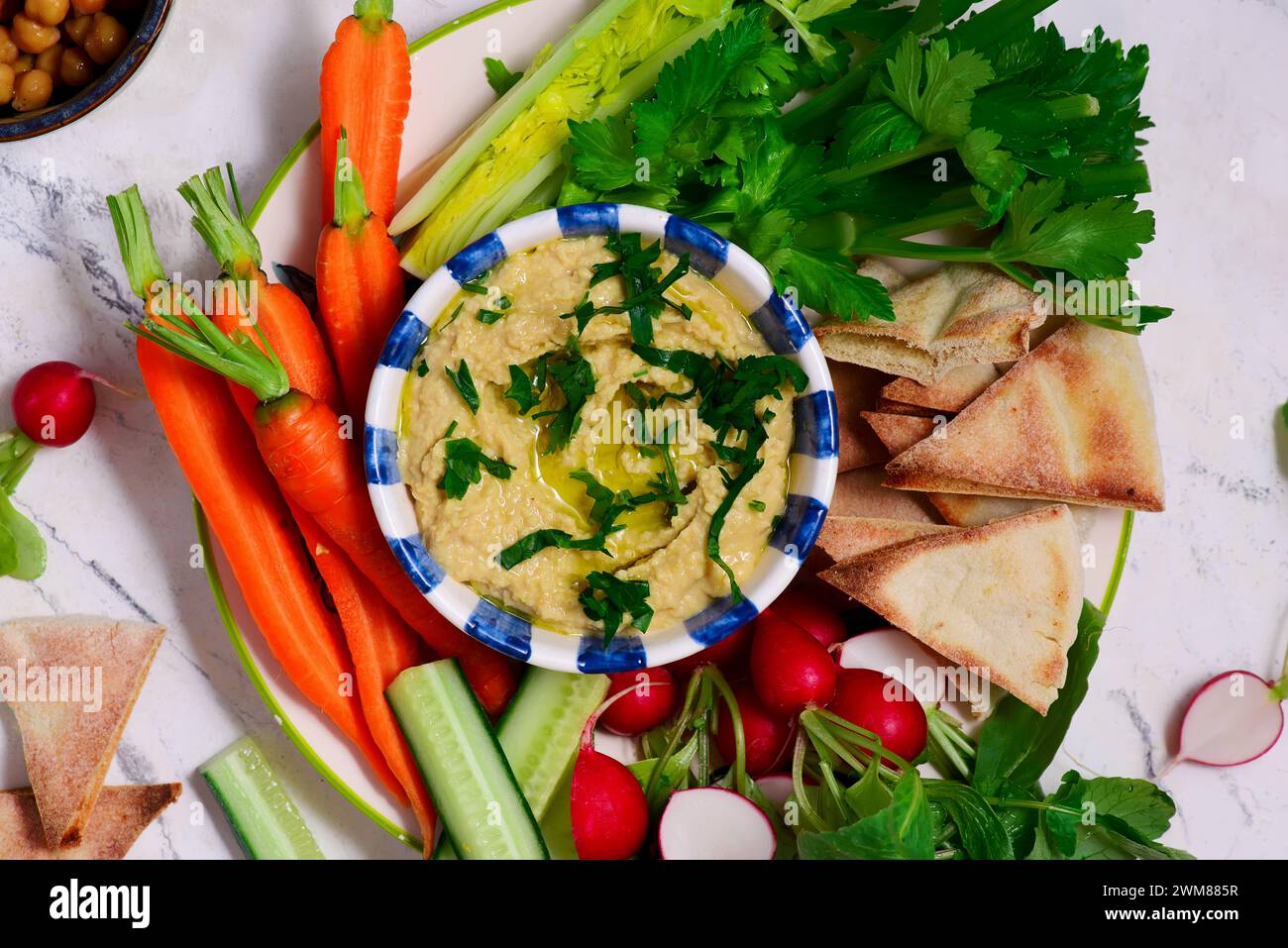 Hummus with fresh crispy vegetables. top view..selective focus Stock ...