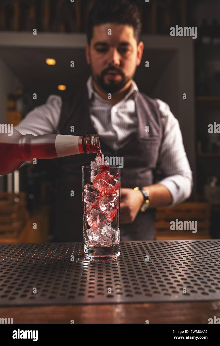 Barman making cocktail on bar counter Stock Photo - Alamy