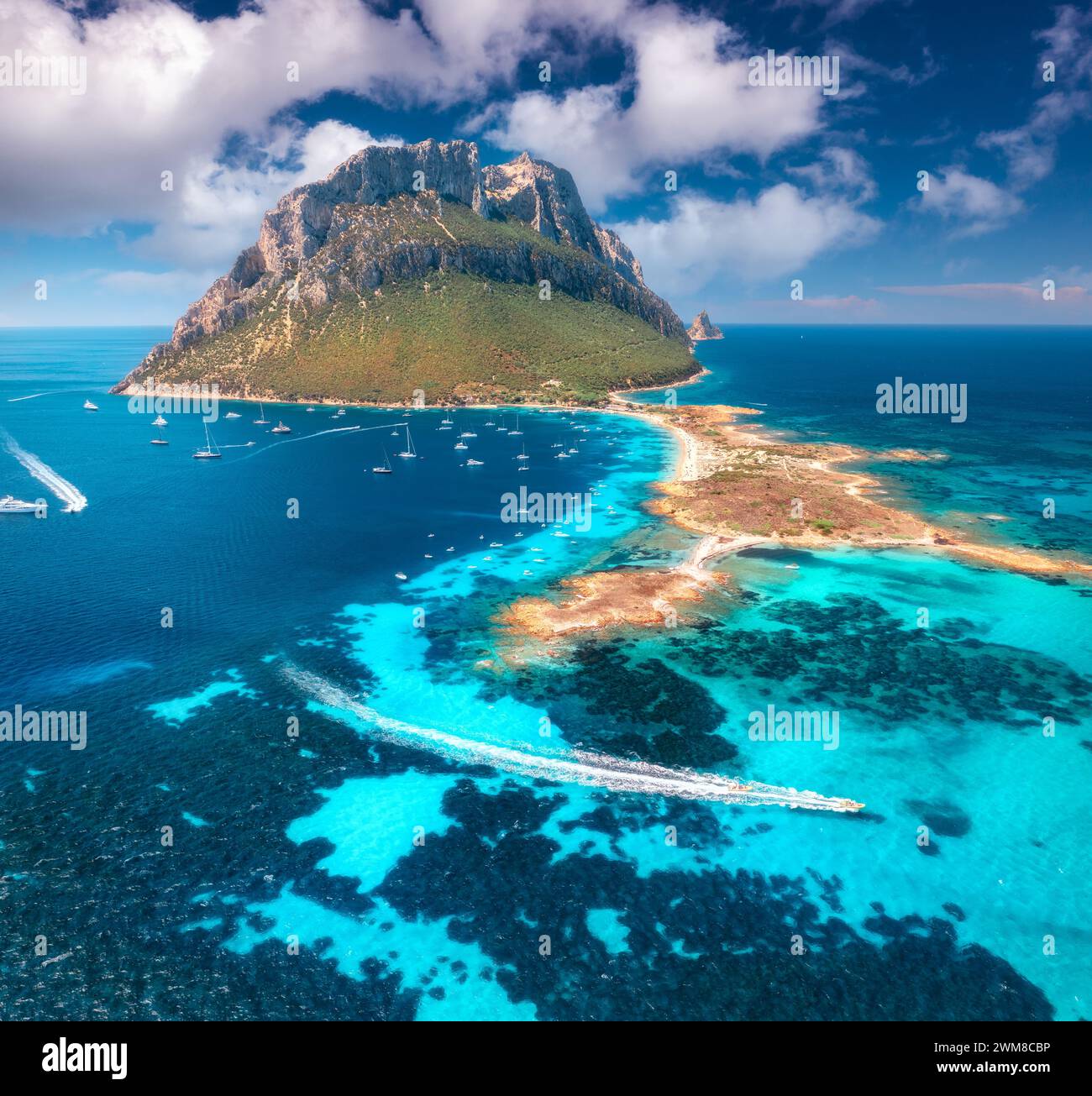 Aerial view of luxury yachts and floating speed boats on blue sea Stock ...