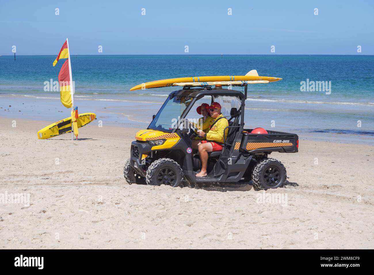 Surf and rescue lifesavers riding a beach buggy in Adelaide, Australia ...