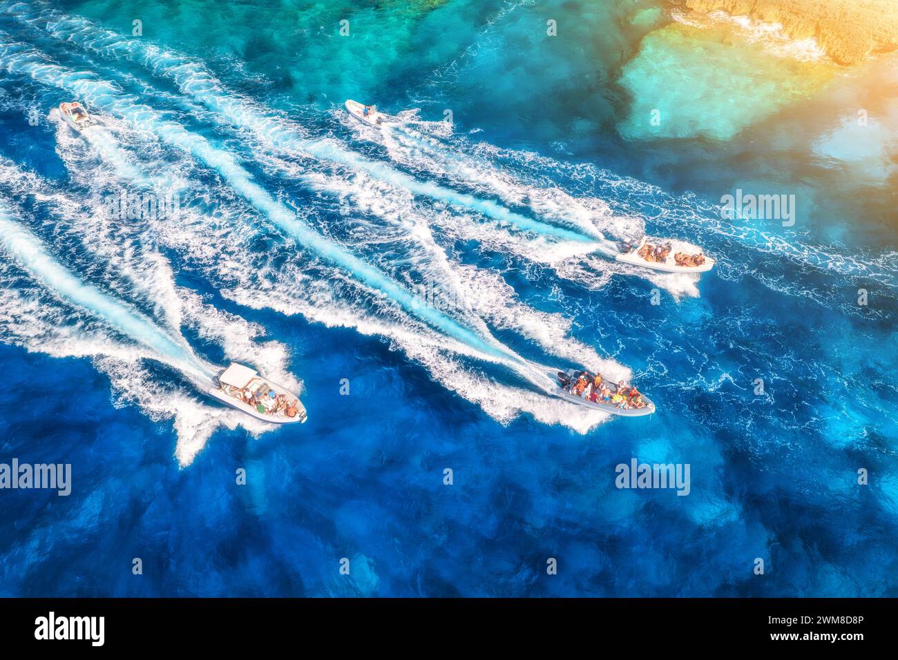 Aerial view of fast floating yachts and boats on blue sea Stock Photo ...