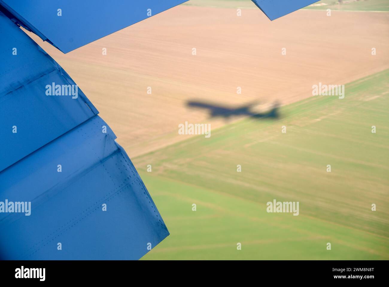 View of the wing flap from window seat on Air France/KLM with shadow on ...