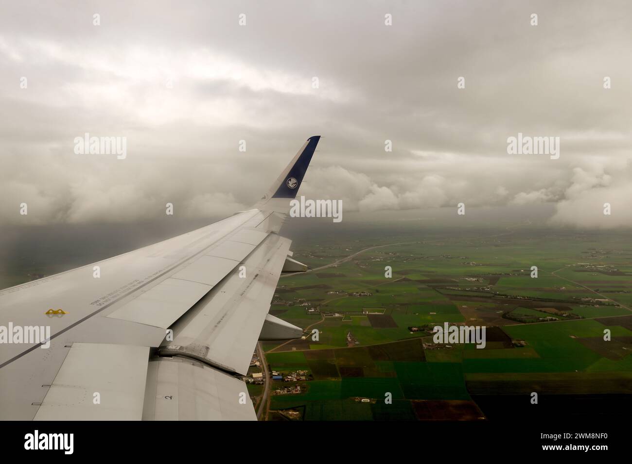 View out of commerical airplane window over wing on Air France/KLM jet ...