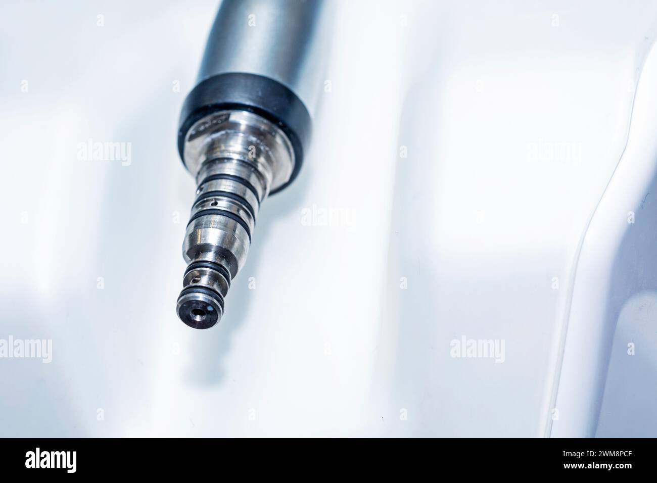 close-up of a dental bur machine attachment. Treatment and restoration ...