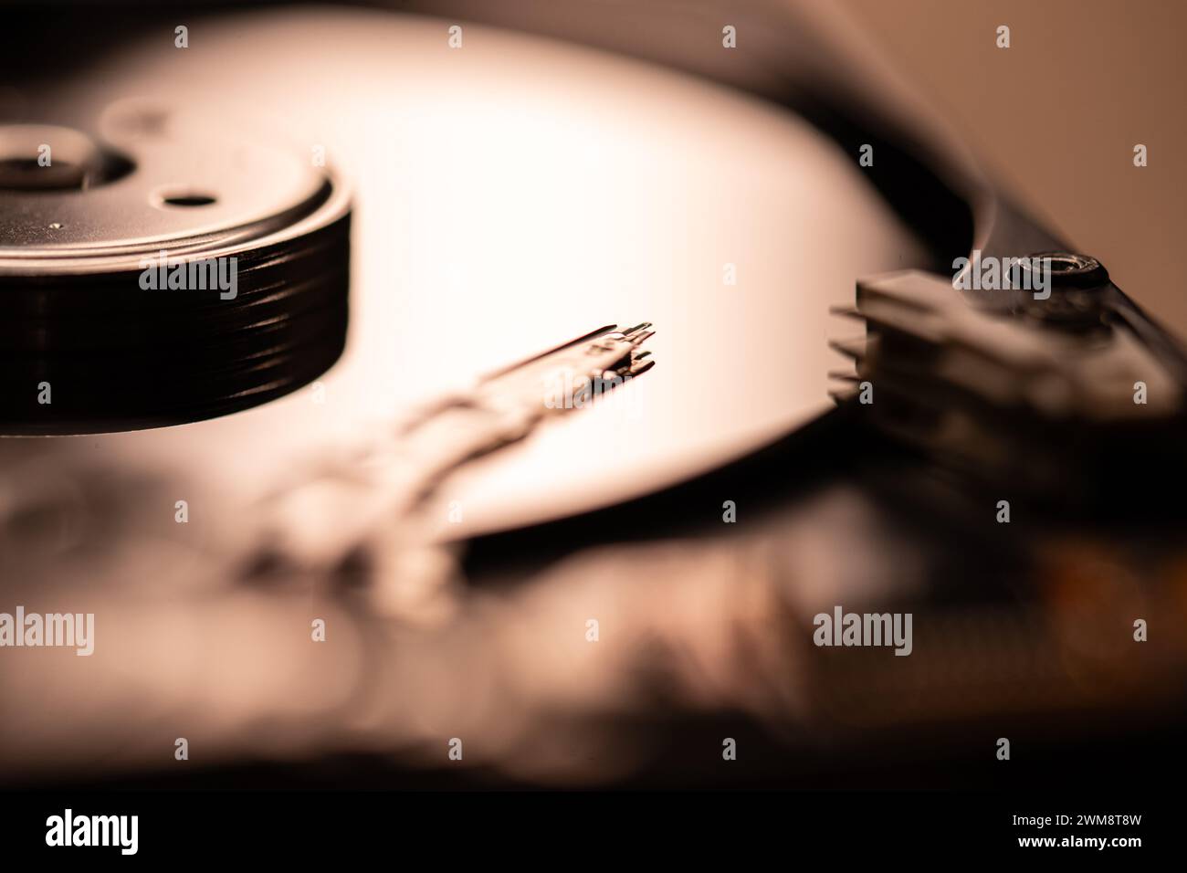 Mechanics inside a hard disk drive with platter and read write head ...