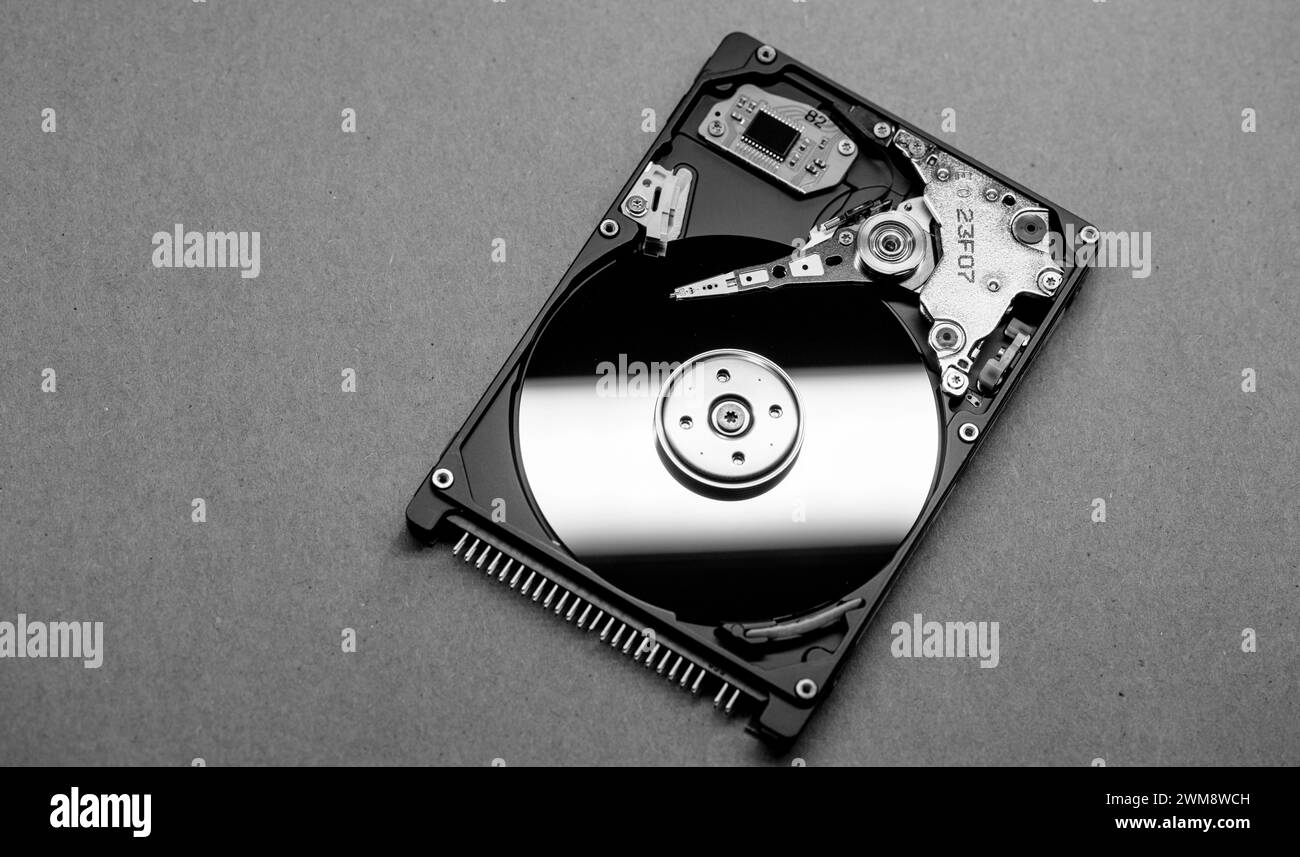 Mechanics inside a hard disk drive with platter and read write head ...