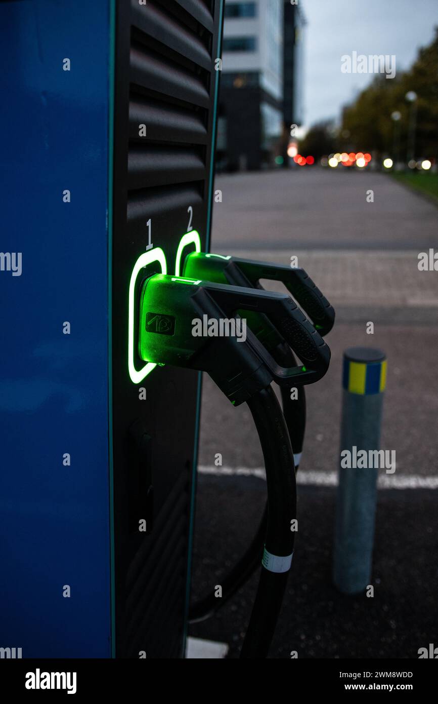 Two charging handles of an electric car charger Stock Photo - Alamy